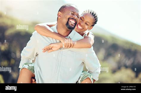 Happy Couple And Black Woman Getting A Piggy Back Ride From African