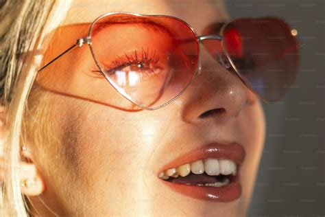 Woman Wearing Heart Shaped Sunglasses With Red Lenses Photo Face