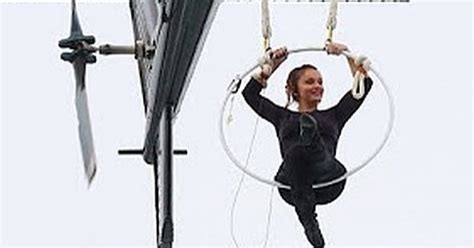 Erendira Wallenda dangles by teeth over Niagara Falls