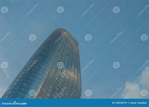 Angular Geometric Mirror Cladding On A Modern Building With Repeating Structure And Reflected