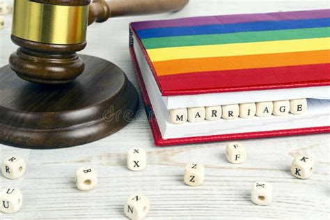 Judge Gavel With Word Marriage In Wooden Blocks In Red Notebook And