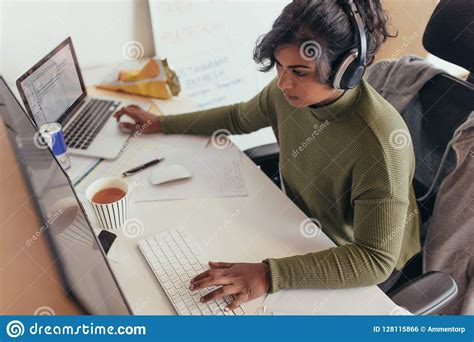 Female Programmer Coding On Computer Female Programmer Coding On A