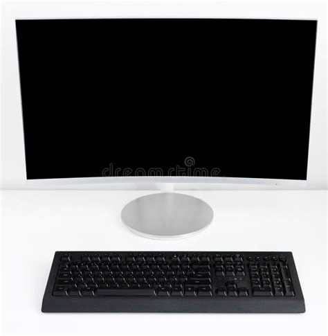 There Is A Monitor With A Black Screen And A Non Black Keyboard On A
