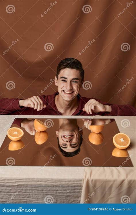 Man At The Table With Oranges And Fabric Background Cropped View Stock Photo Image Of Healthy