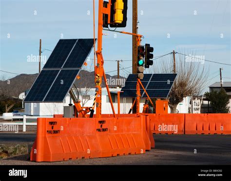 Temporary Solar Powered Traffic Control Lights At A Street Intersection