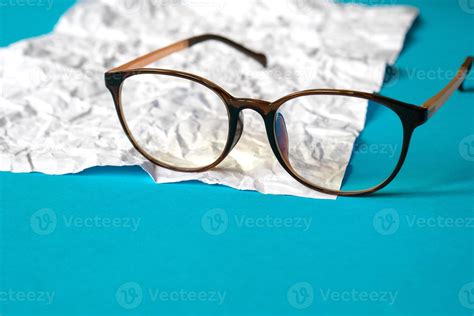 White Crumpled Paper And Blue Paper Eyeglass Concept 8727638 Stock