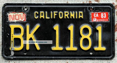 1963 Yellow On Black California License Plate With A 1983 Sticker