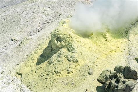 Premium Photo Yellow Cone Of Crystallized Sulfur Around A Smoking