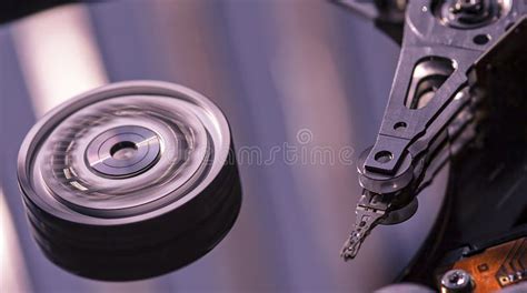 Hard Disk Drive Reading Data With Its Head On A Spinning Platter Stock
