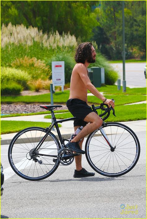 Mateo Arias Takes A Shirtless Bike Ride With A Full Beard And Long Hair
