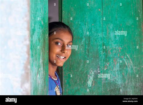 School Girl Peeping From A Classroom Stock Photo Alamy