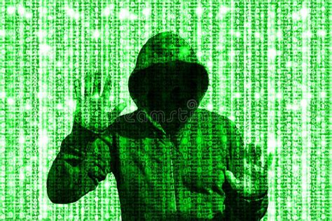 Computer Hacker Silhouette Of Hooded Man With Binary Data Screen And Network Security Terms