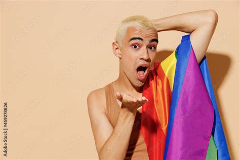 Young Smiling Happy Sexy Blond Latin Gay Man With Make Up In Beige Tank