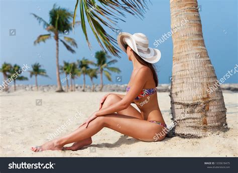 Стоковая фотография 1333618475 Sexy Beautiful Tanned Woman Relaxing