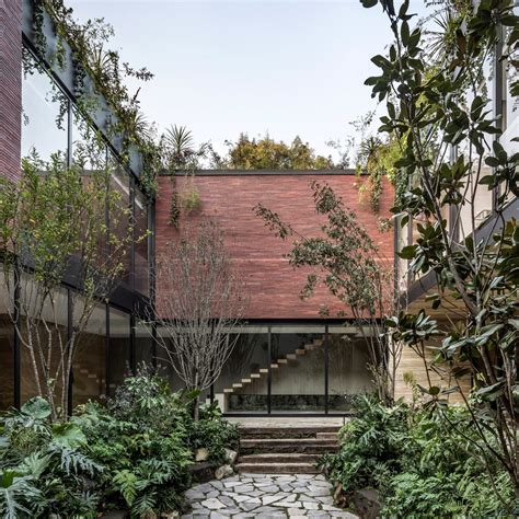 Escobedo Soliz Wraps Brick House For Retired Teacher Around A Patio