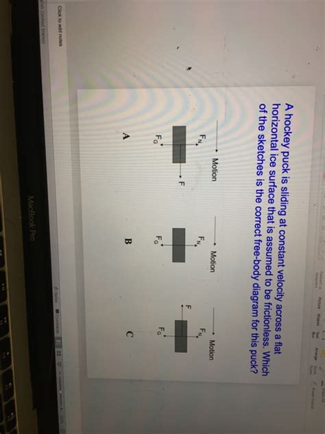 solved a hockey puck is sliding at constant velocity across