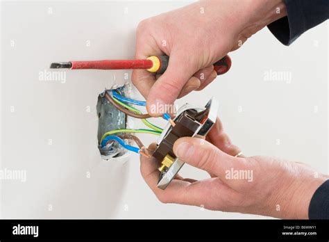 An Electrician Fixing A Socket Stock Photo Alamy