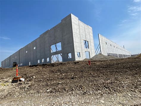Building With Precast Concrete Protecting Against High Velocity Projectiles From Tornadoes