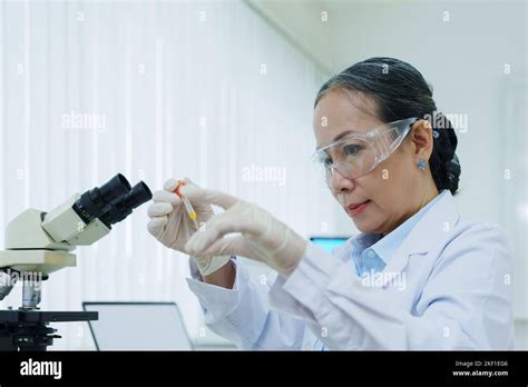 Scientists Analyze Chemical Samples Discuss Technological Innovations