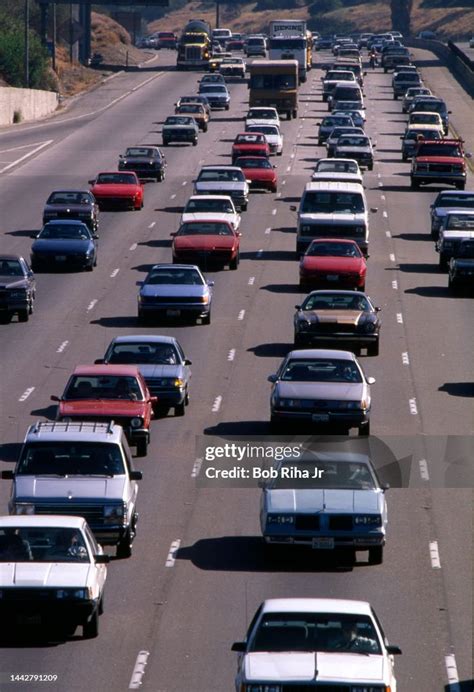 Vehicles And Trucks Share The Freeway In Daily Traffic Congestion