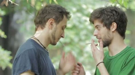 Two Cute Young Gay Smoking A Cigarette Together — Stock Video