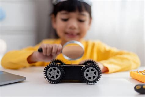 Premium Photo Asia Students Learn At Home In Coding Robot Cars And
