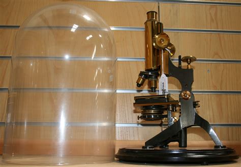 A Lacquered And Oxidised Brass Monocular Microscope Signed W Watson