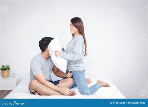 Asian Couples Tease Each Other On The Bed In The Bedroom Stock Image Image Of Married