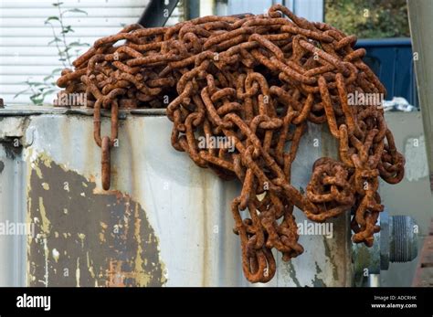 Rusty Old Chain In A Vehicle Scrap Yard Stock Photo Alamy