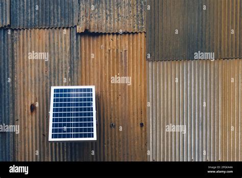 Solar Panel Attached On Old Zinc Wall Electric Solar Panel On The