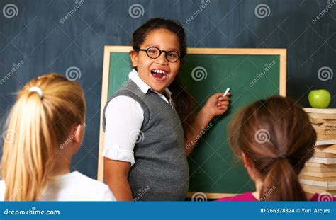 Shes Always Helping Her Classmates Portrait Of A Cute Girl Showing Her