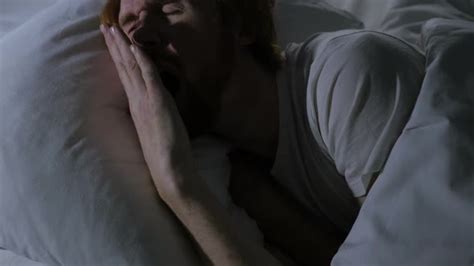 Tired Redhead Beard Man Yawning While Lying In Bed At Night Stock Footage