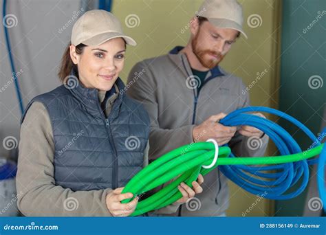 Female And Male Electrician Installing Electrical Wiring Stock Image Image Of Caucasian