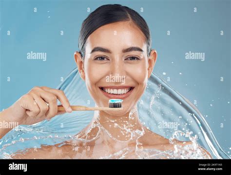 Woman Brushing Teeth Water Splash And Toothbrush Toothpaste And