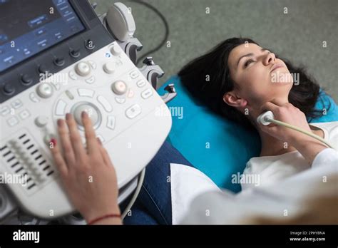 Doctor Using Ultrasound Scanning Machine For Examining A Thyroid Of Woman Stock Photo Alamy