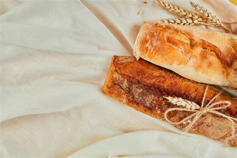 Premium Photo Top View Of Two Baguette Bread On A Textile Surface Concept Of Homemade Bread