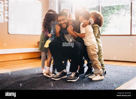 Teacher And Students Greet Each Other Excitedly Elementary School
