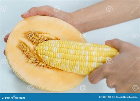 Melon And Sweet Corn On White Background Sex Concept Stock Image
