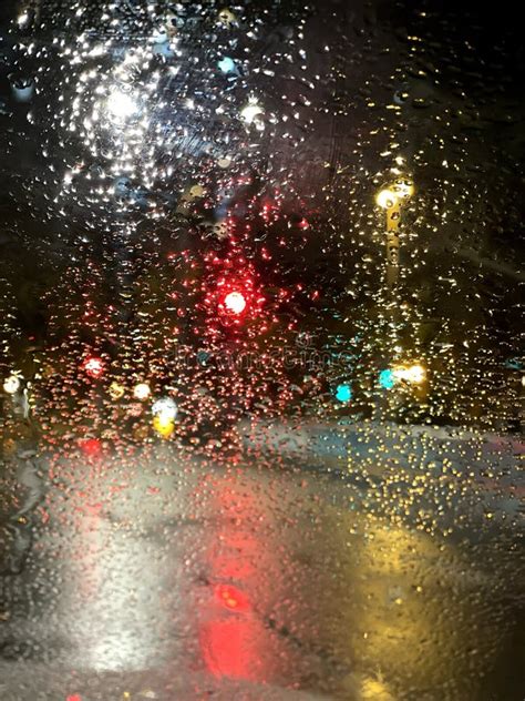 Vertical Defocused Street Light And Traffic Lights With Raindrop