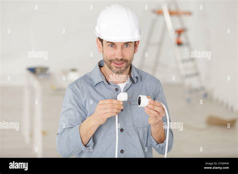 A Man Holding Cable Plugs Stock Photo Alamy