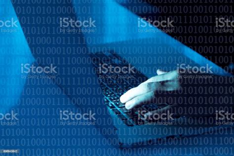 A Computer Programmer Or Hacker Prints A Code On A Laptop Keyboard To Break Into A Secret