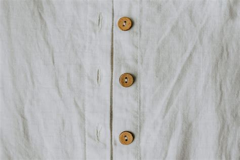 흰색 표면에 있는 작은 둥근 물체 그룹 사진 Unsplash의 텍스처 이미지