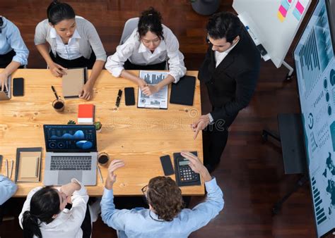Wide Top View Diverse Analyst Team Analyzing Financial Data Meticulous