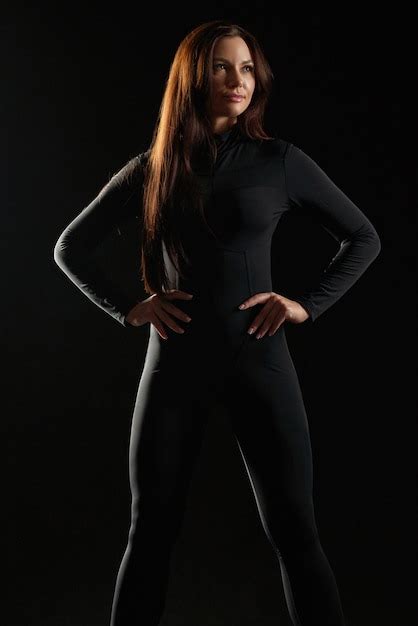 Free Photo Confident Woman In Black Apparel Standing In Low Light
