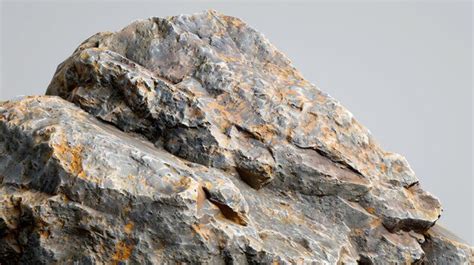 A Large Angular Rock With A Rough Textured Surface The Rock Is A Dark Gray Color With Some