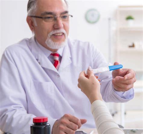Pregnant Woman Visiting Experienced Doctor Gynecologist Stock Image