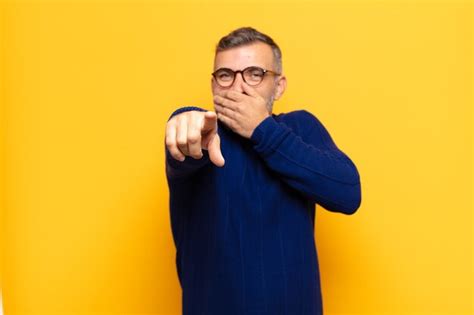 Premium Photo Adult Handsome Man Laughing At You Pointing To Camera And Making Fun Of Or