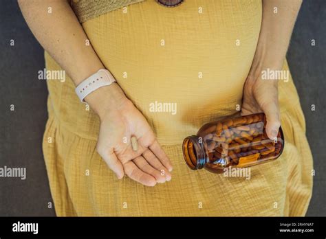 Prenatal Vitamins Portrait Of Beautiful Smiling Pregnant Woman Holding