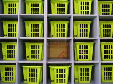 Empty Cell Among Filled Cells With Plastic Storage Boxes At Storage