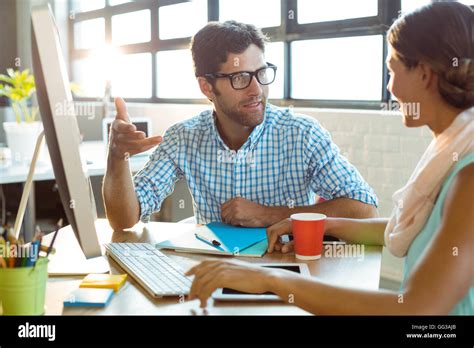 Business executives interacting with each other Stock Photo - Alamy